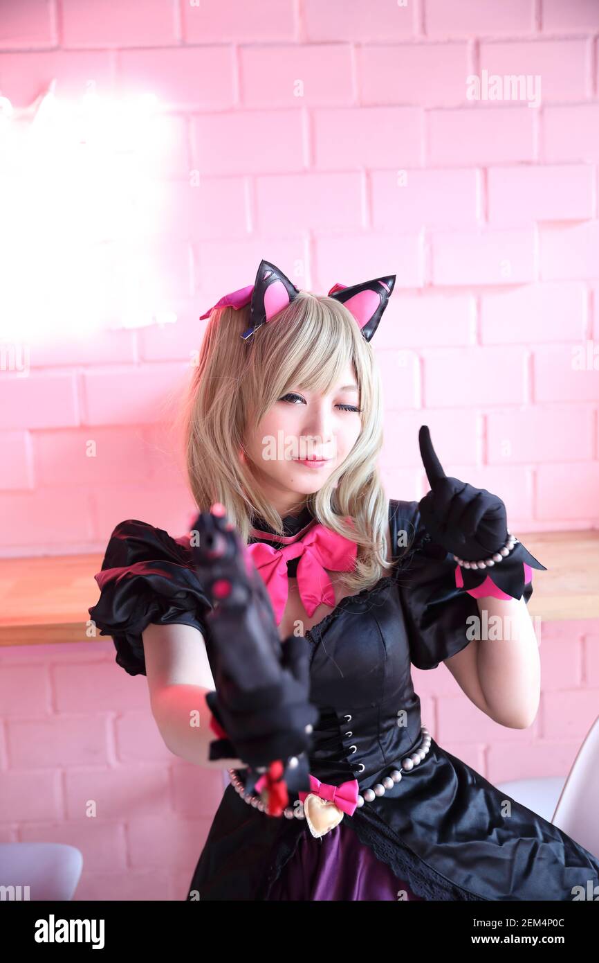 Japan anime cosplay , portrait of girl cosplay in pink room background ...