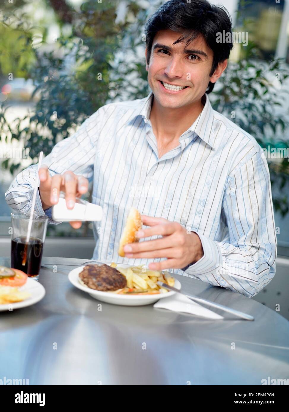 Person plate pouring salt hi-res stock photography and images - Alamy