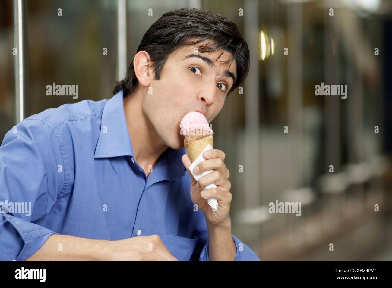 Man eating ice cream cone hi-res stock photography and images - Alamy