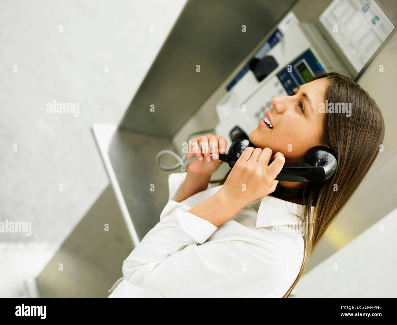 Side profile of a girl talking on a phone Stock Photo - Alamy