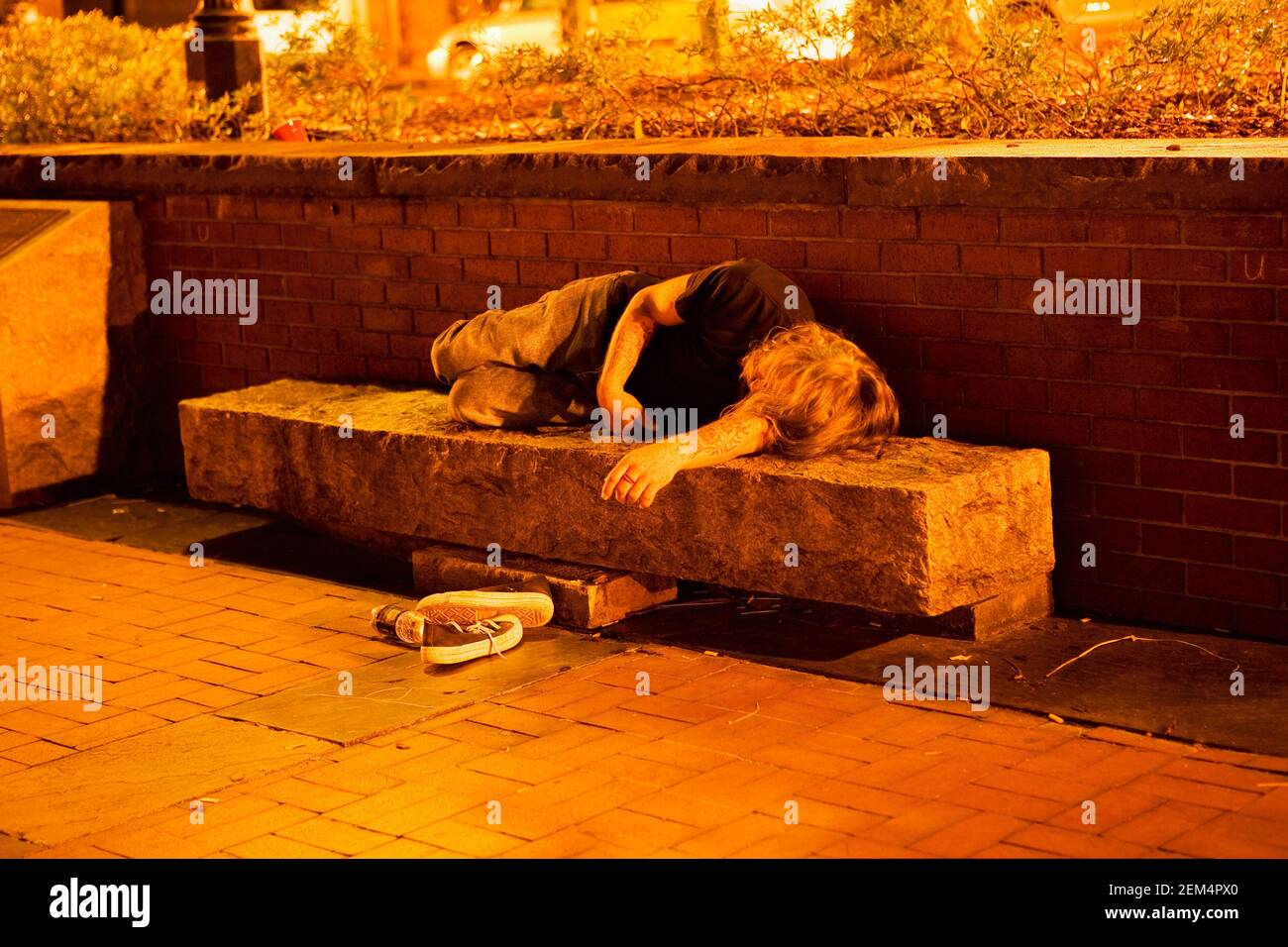 Man lying down bench hi-res stock photography and images - Alamy