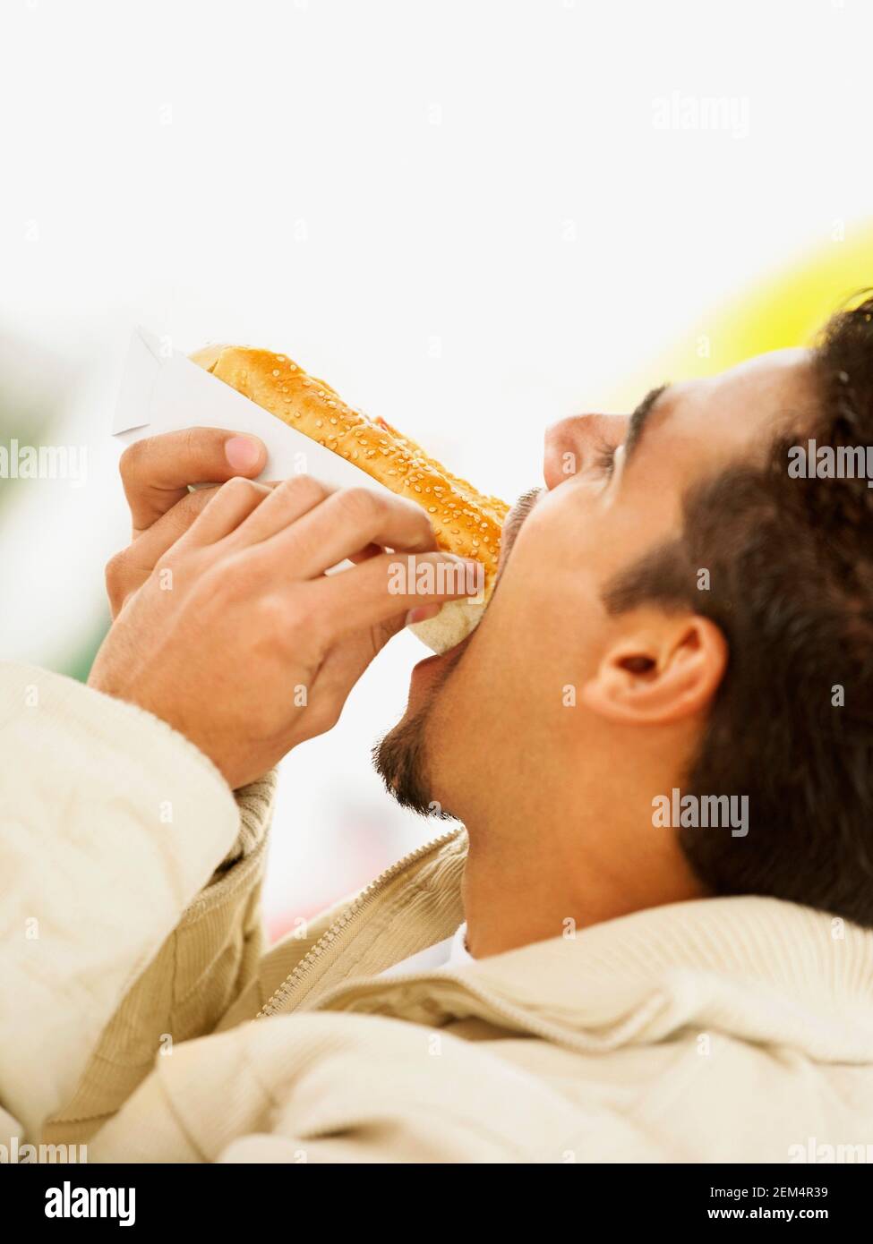Man eating burger side hi-res stock photography and images - Alamy