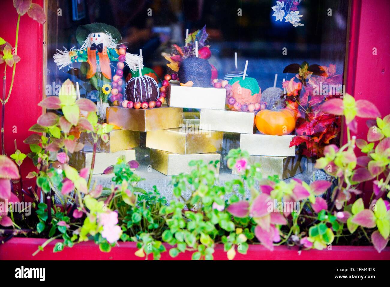 Decorated candles in a window display Stock Photo - Alamy