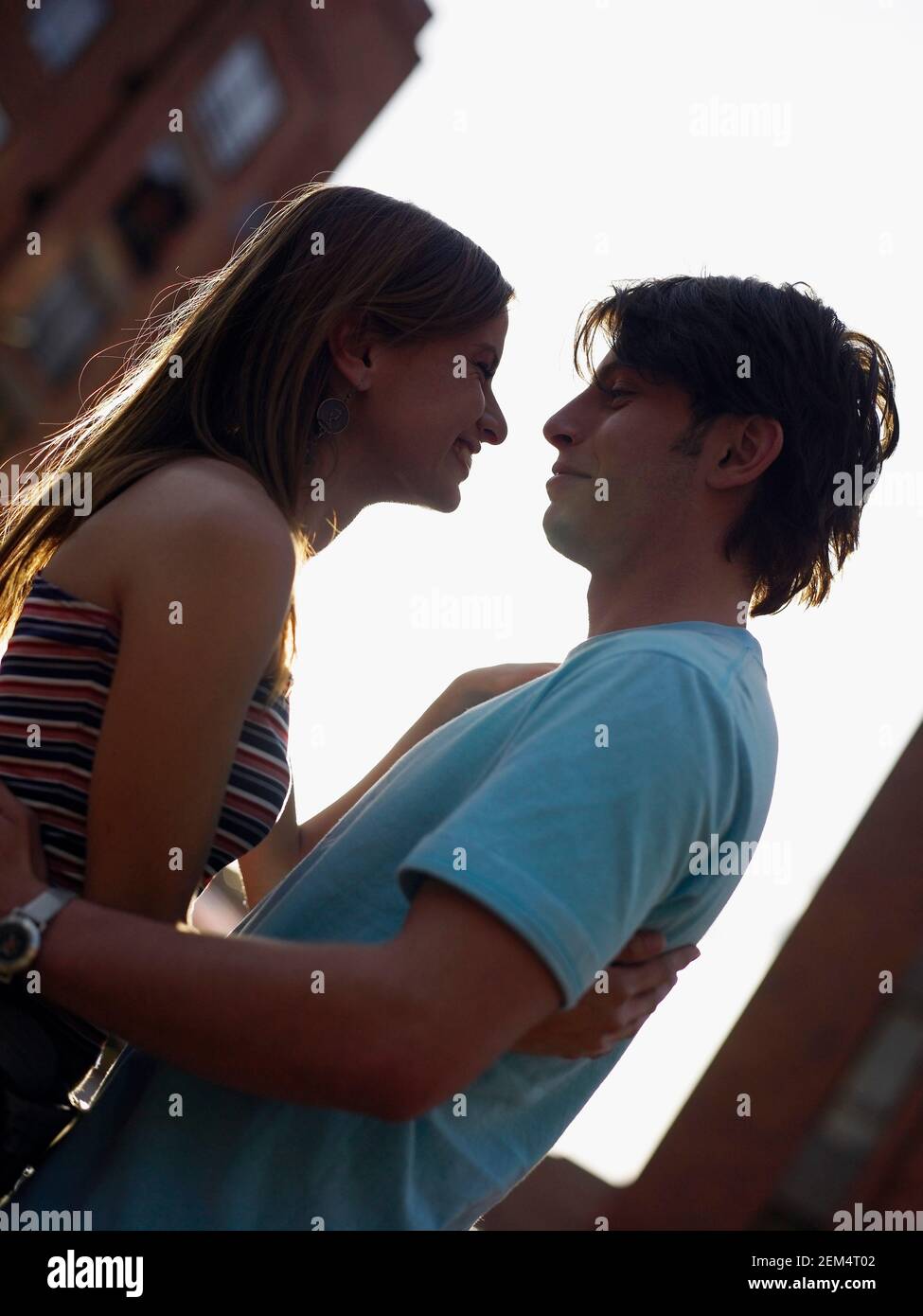 Side profile of two men standing face to face hi-res stock photography ...