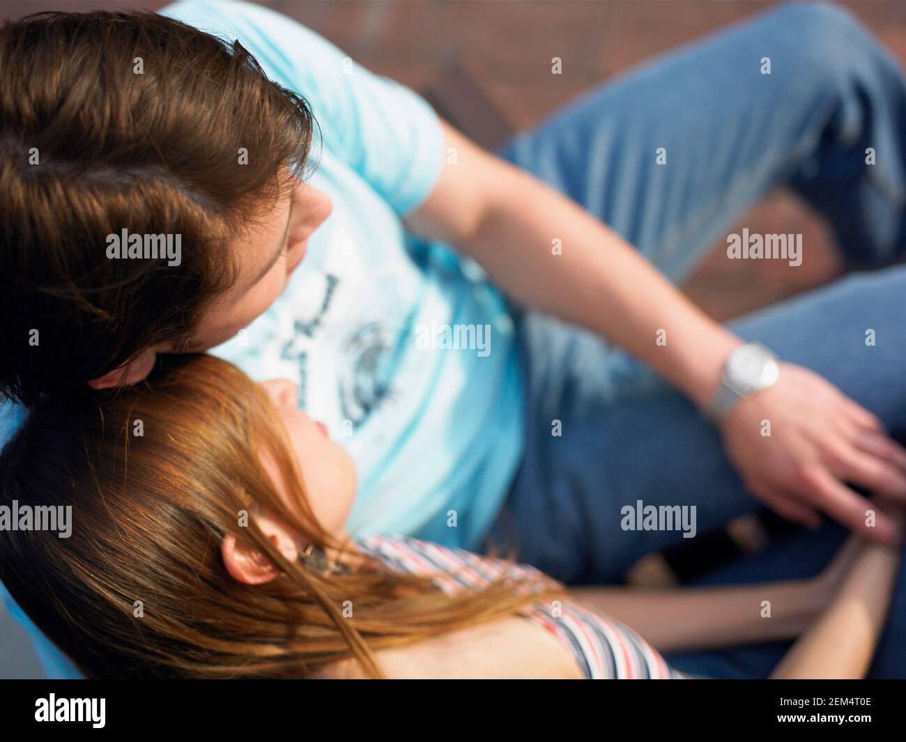 High angle view of a young couple sitting together Stock Photo - Alamy