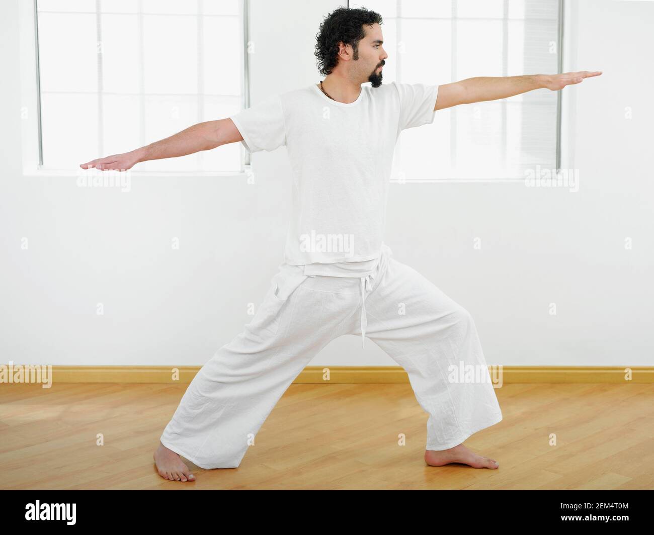 Hispanic man stretching arm hi-res stock photography and images - Alamy
