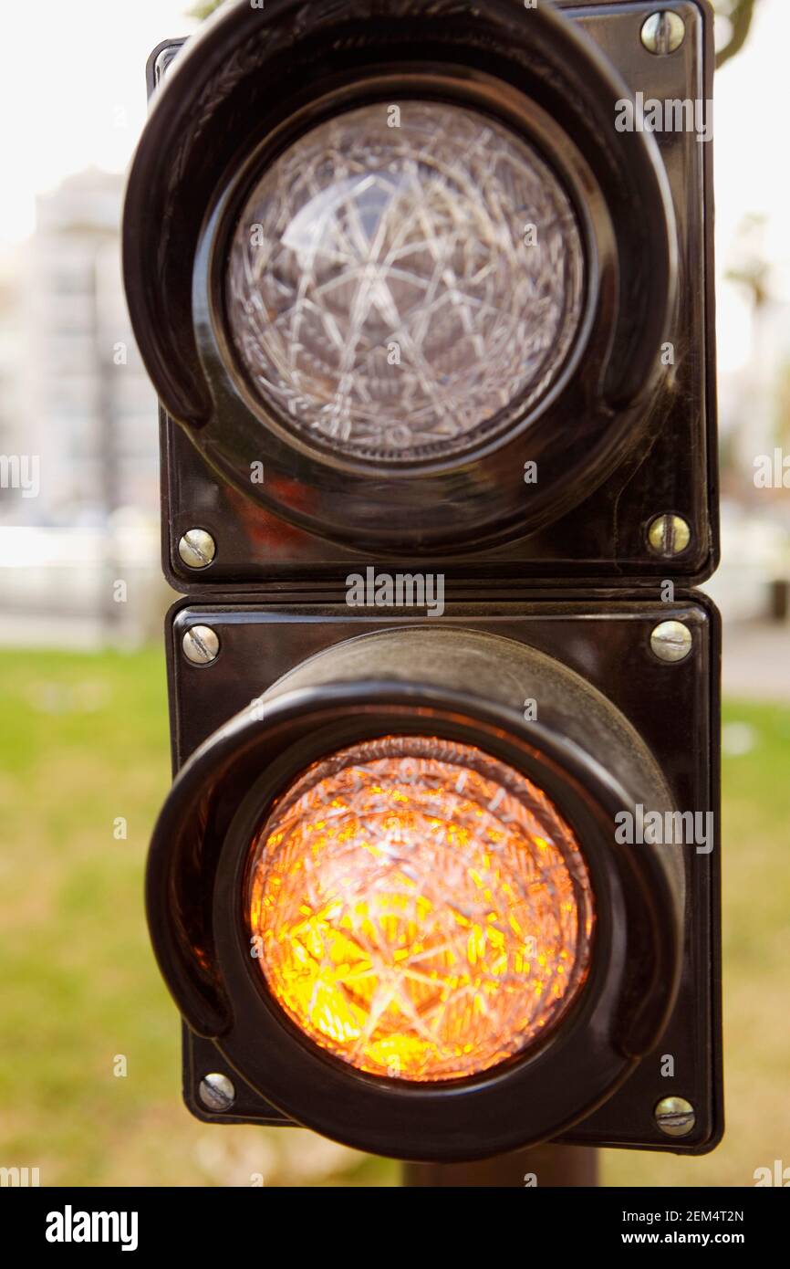 Close-up of a traffic light with the yellow light illuminated Stock ...