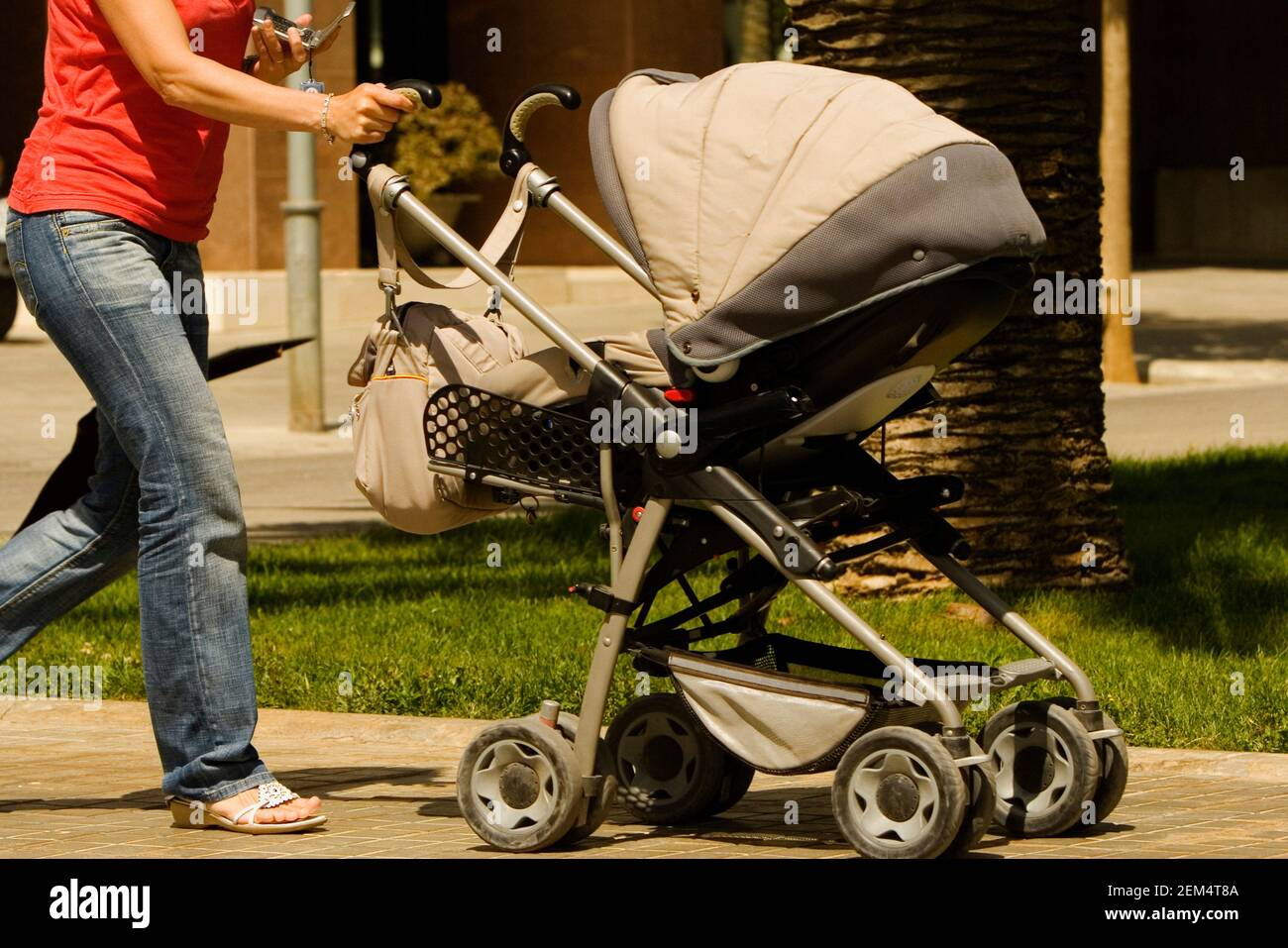 Pushing stroller mobile phone hi-res stock photography and images - Alamy