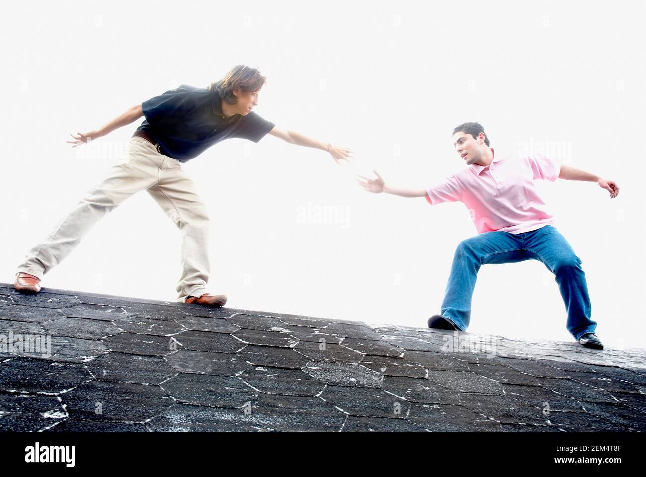 Low angle view of a young man reaching for his friend's hand Stock ...