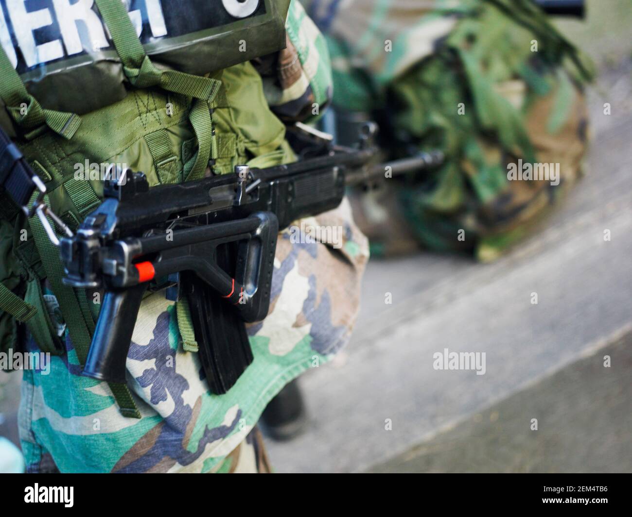 Close-up of a machine gun on the back of an army soldier Stock Photo ...