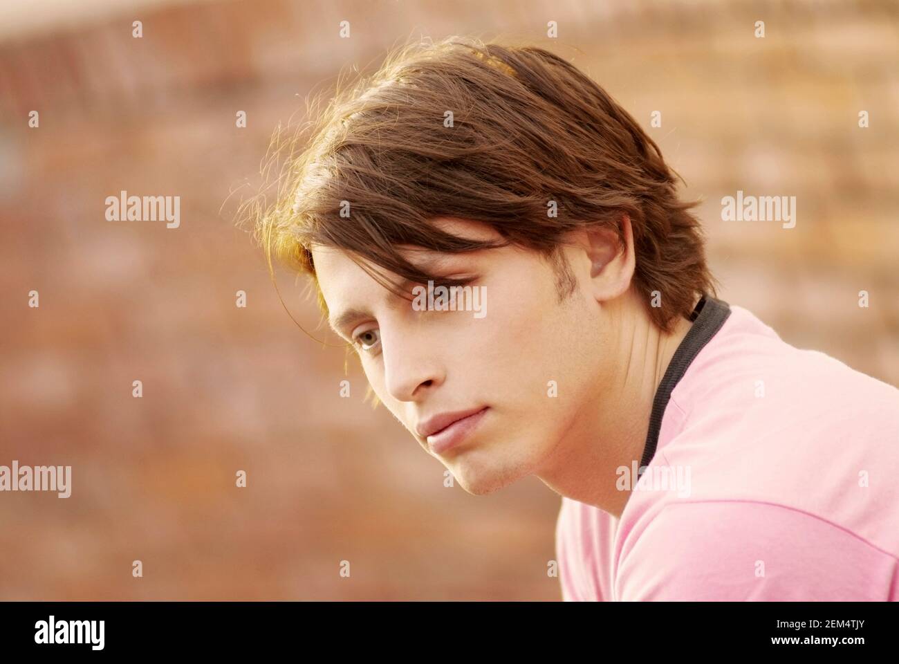 Side profile of a young man looking serious Stock Photo - Alamy