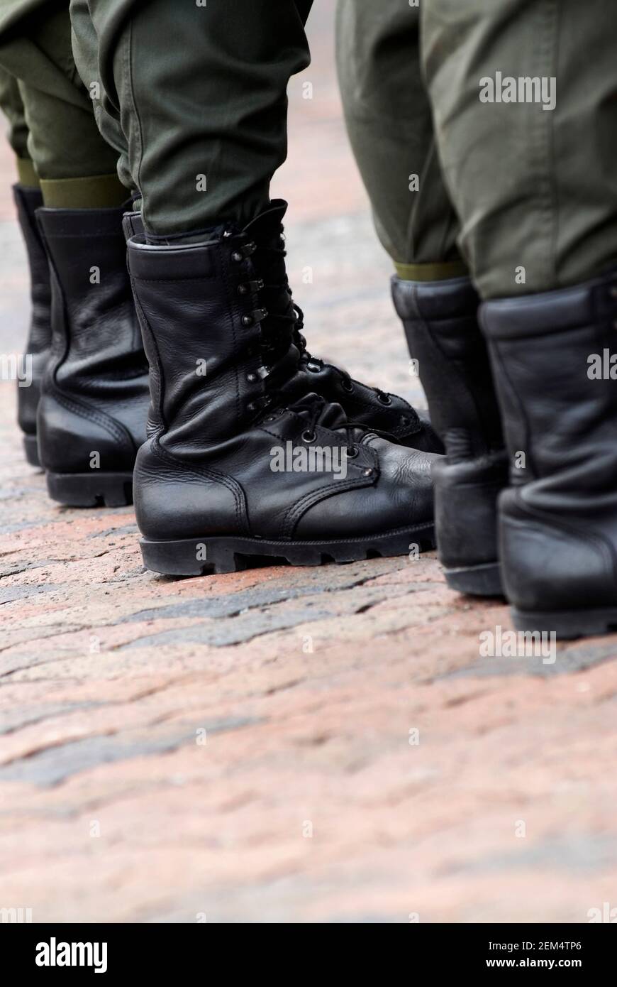 Low section view of three security guards standing Stock Photo - Alamy