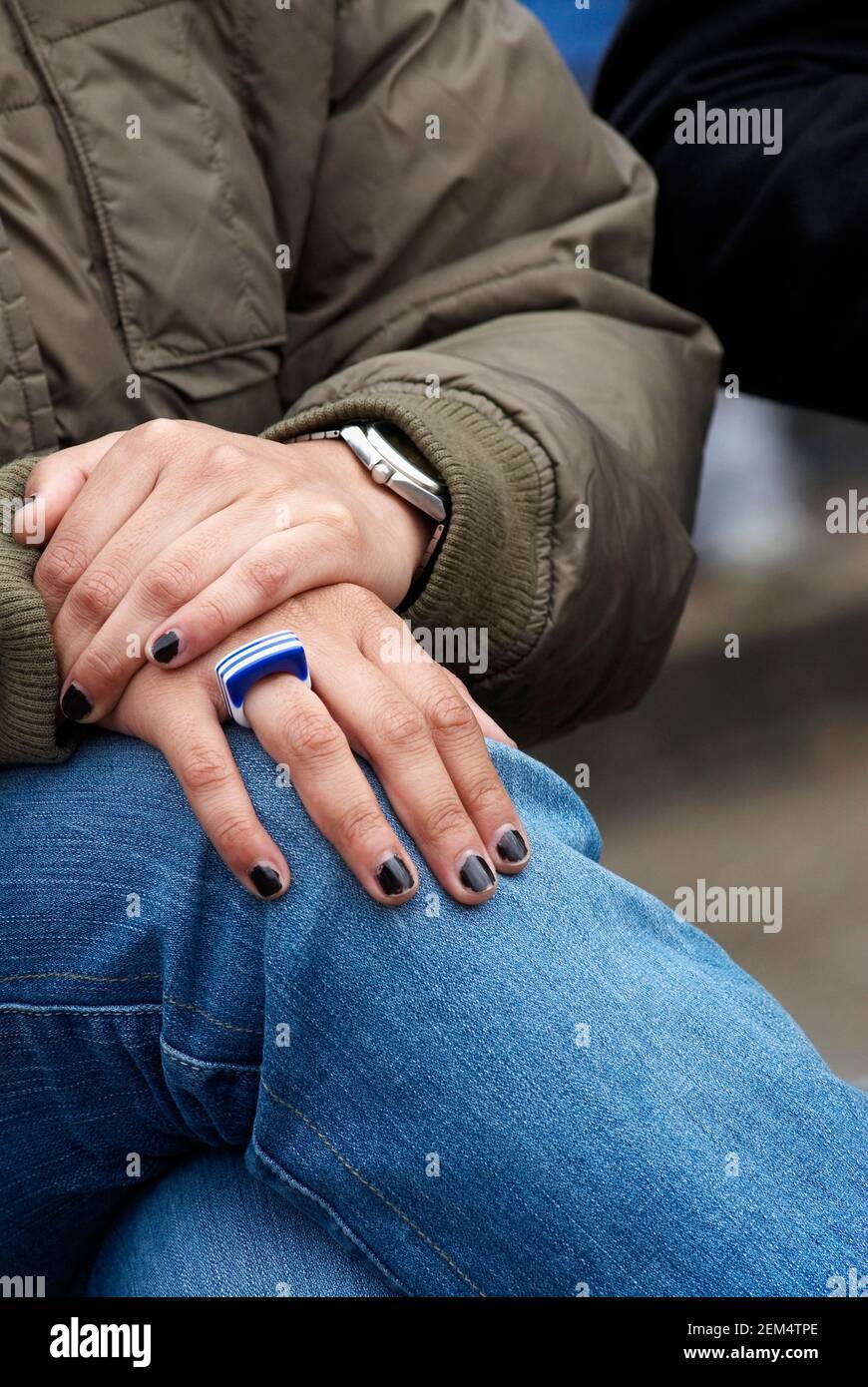 Mid section view of a woman sitting with her legs crossed Stock Photo ...
