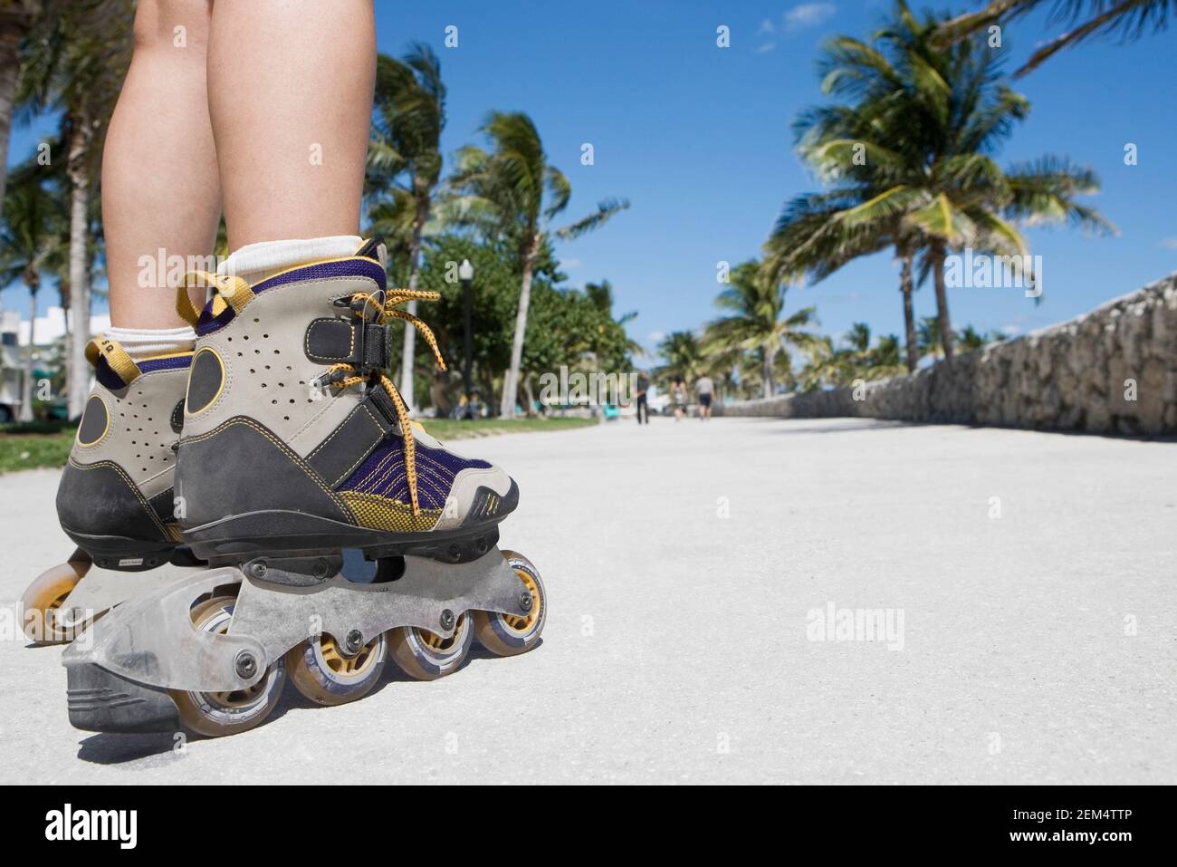 Low section view of a woman inline skating Stock Photo - Alamy