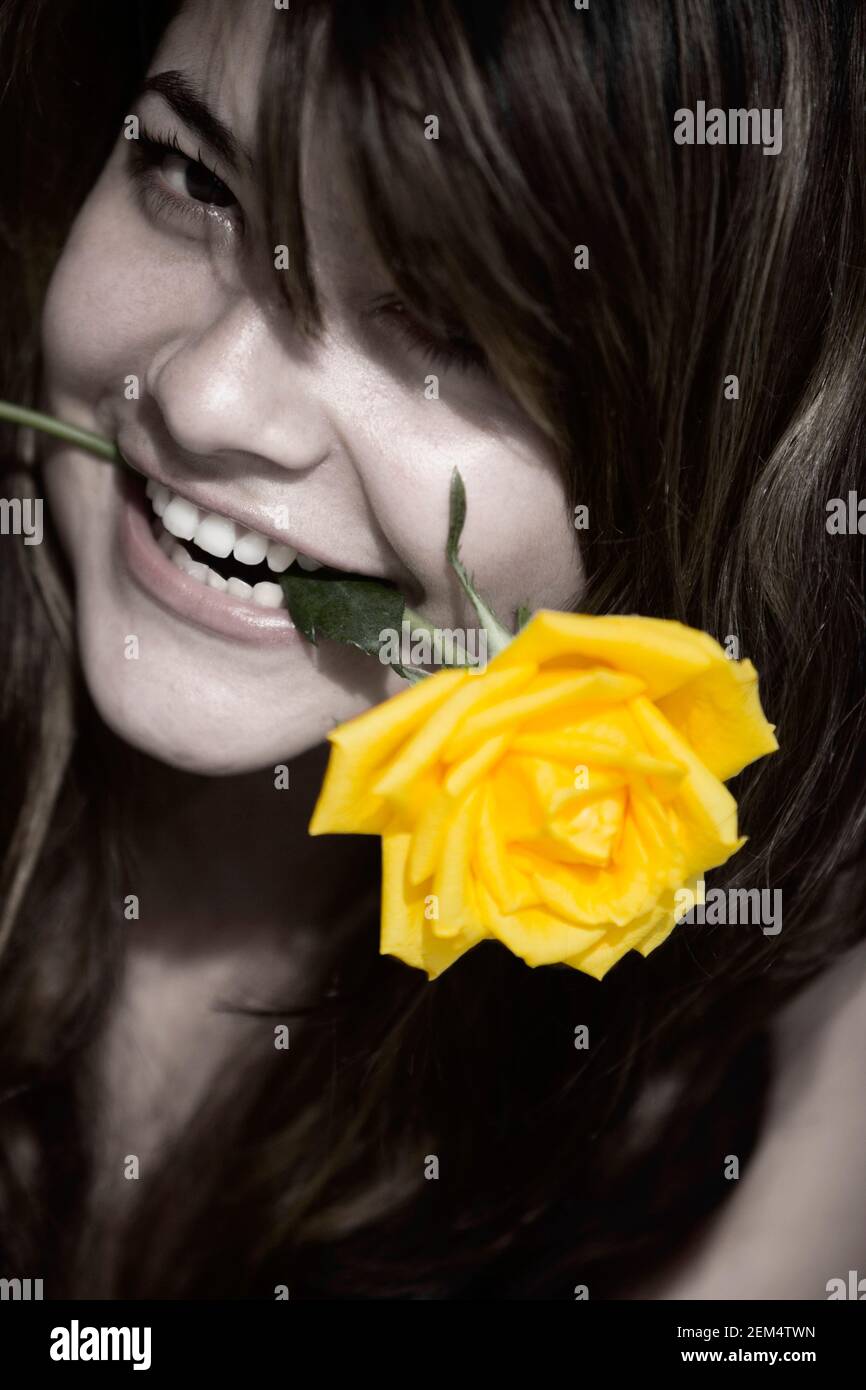 Rose stem between teeth hi-res stock photography and images - Alamy