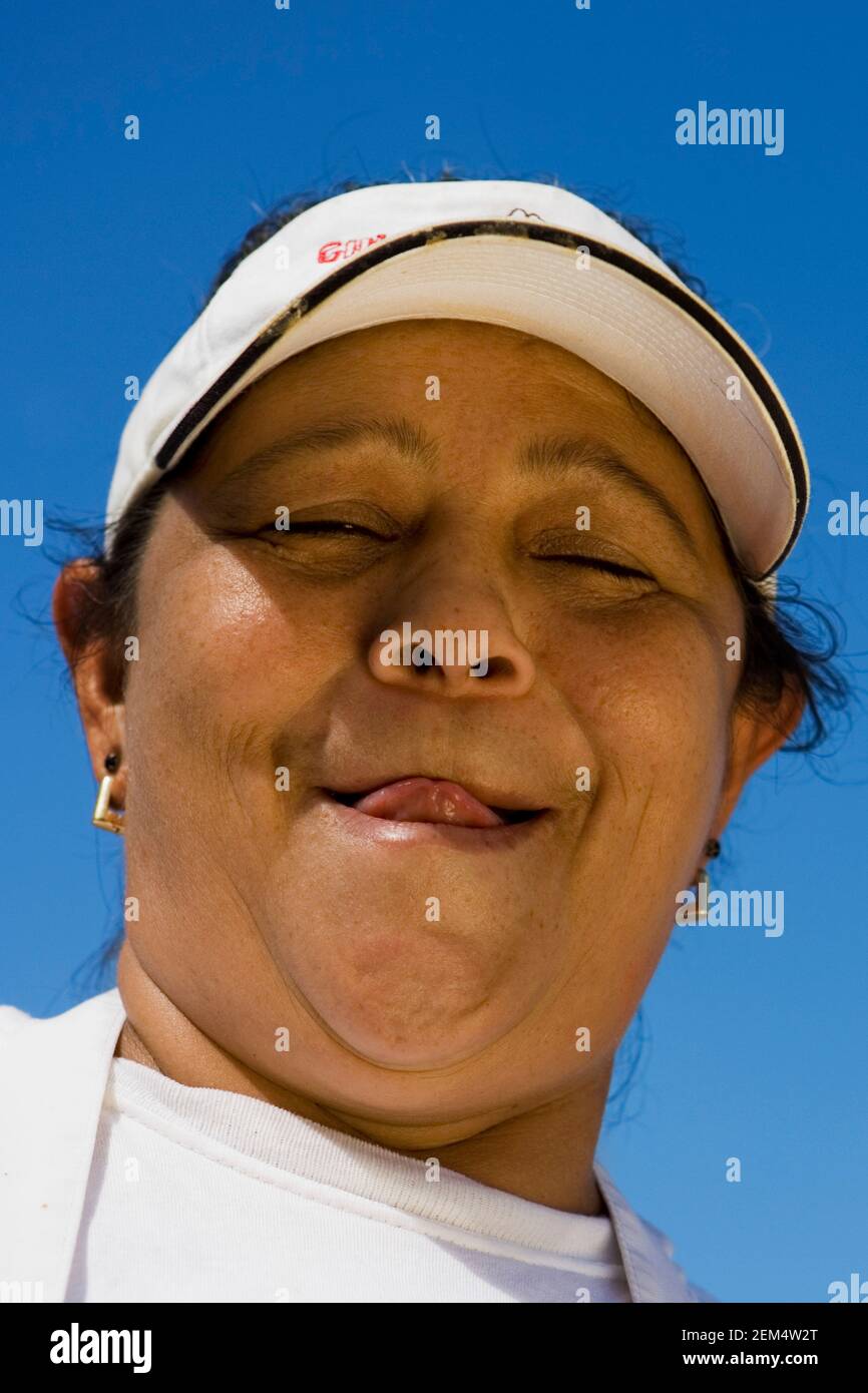 Portrait of a mid adult woman making a face Stock Photo - Alamy
