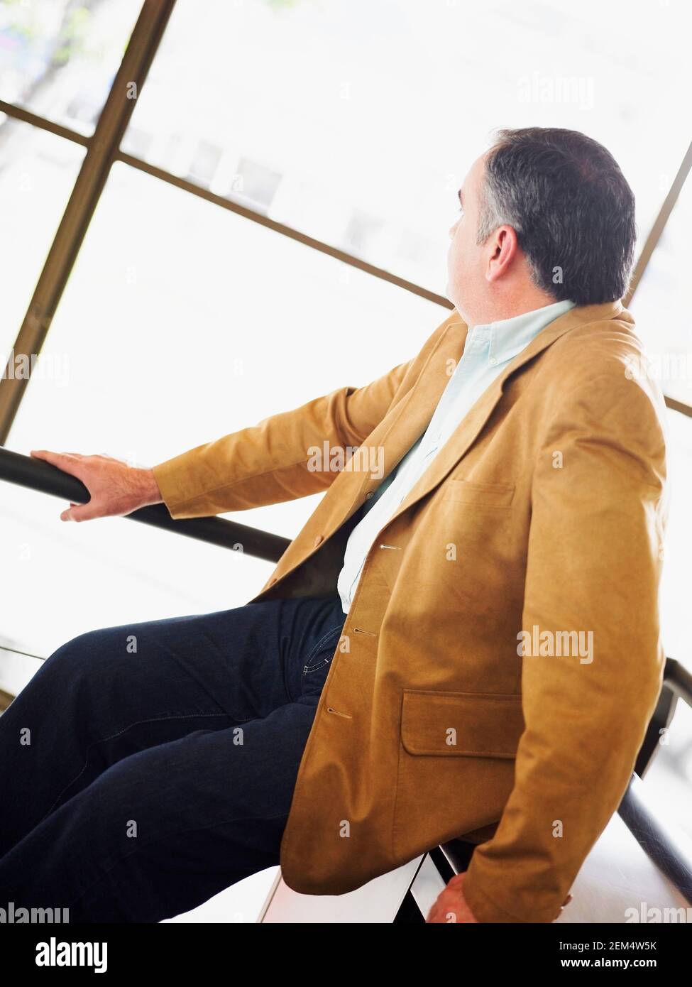 Sitting down profile man hi-res stock photography and images - Alamy