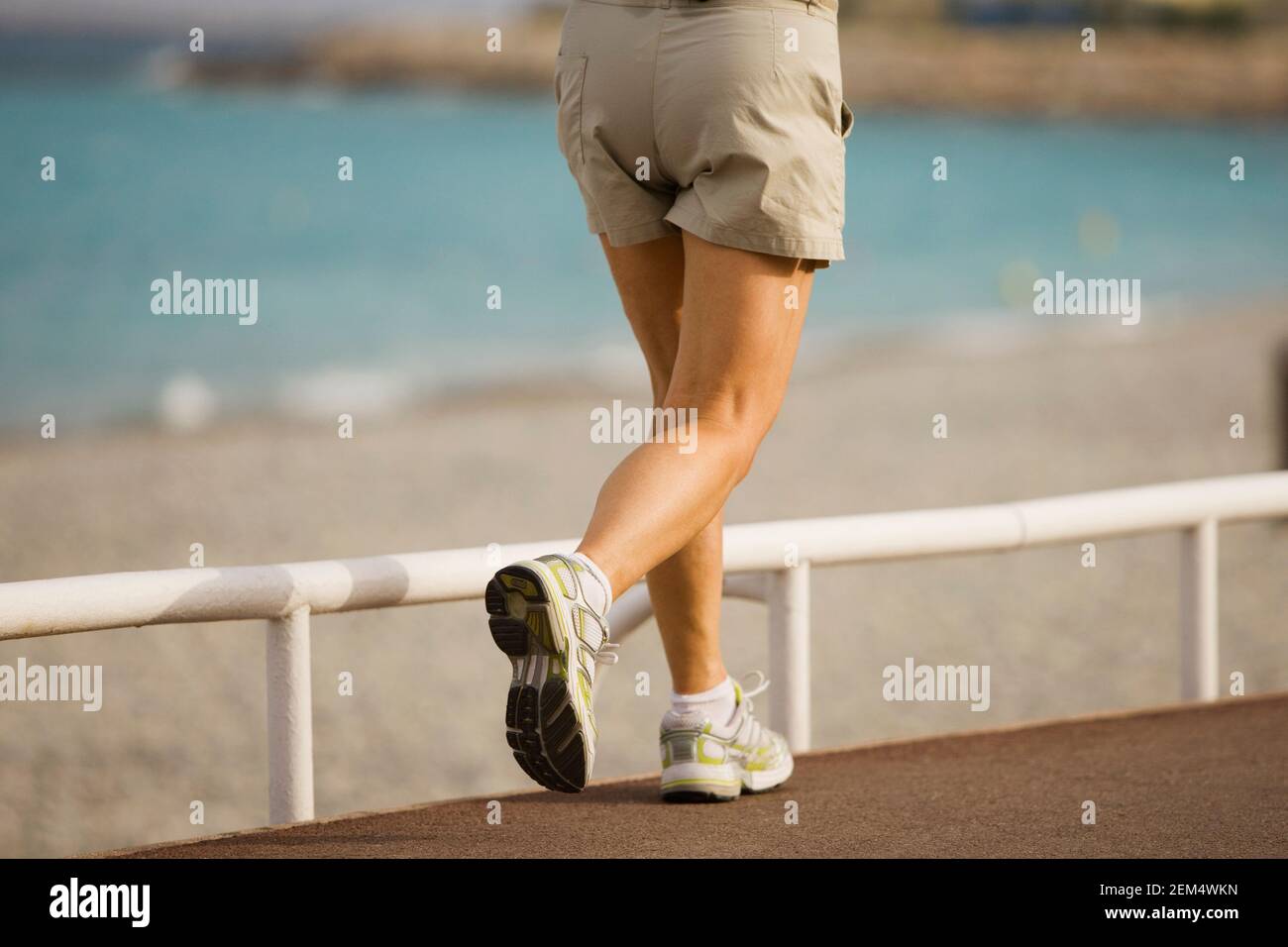 Low section view of a woman jogging Stock Photo - Alamy