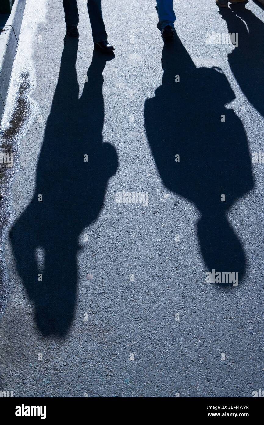 Human shadow on road hi-res stock photography and images - Alamy
