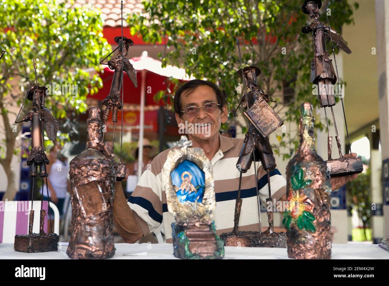 Man standing stall holding hi-res stock photography and images - Alamy