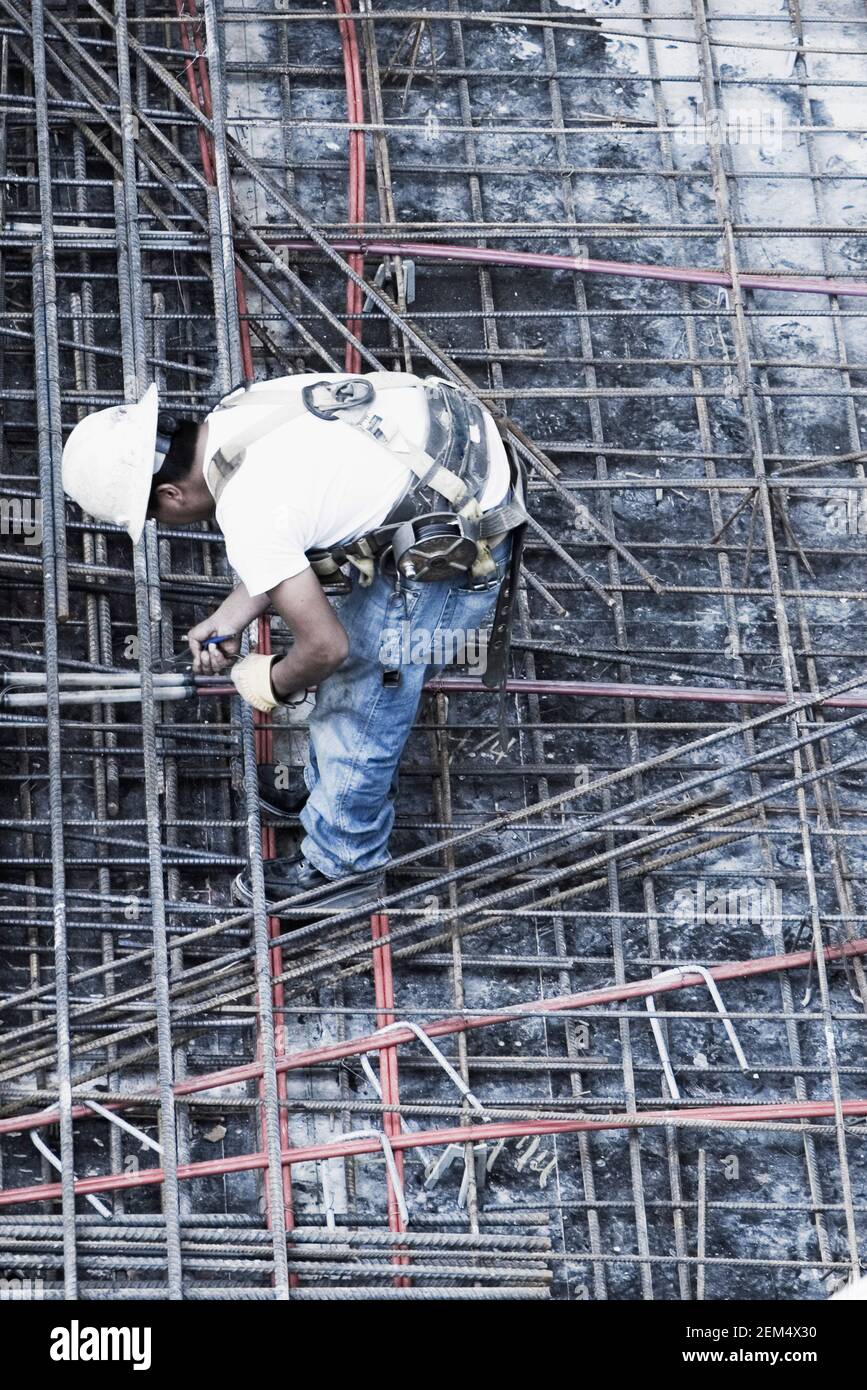 High angle view of a construction worker working at a construction site ...