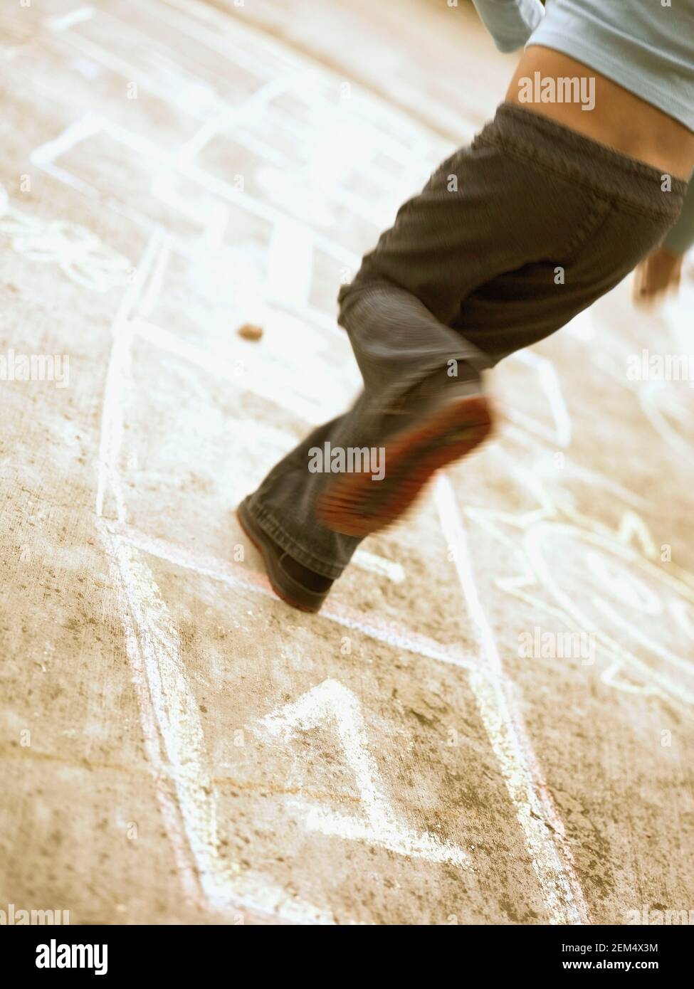 Low section view of a woman playing hopscotch Stock Photo - Alamy