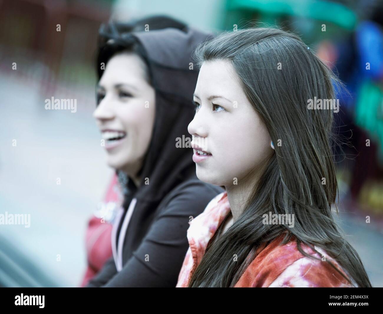 Side profile of a teenage girl and a young woman Stock Photo - Alamy