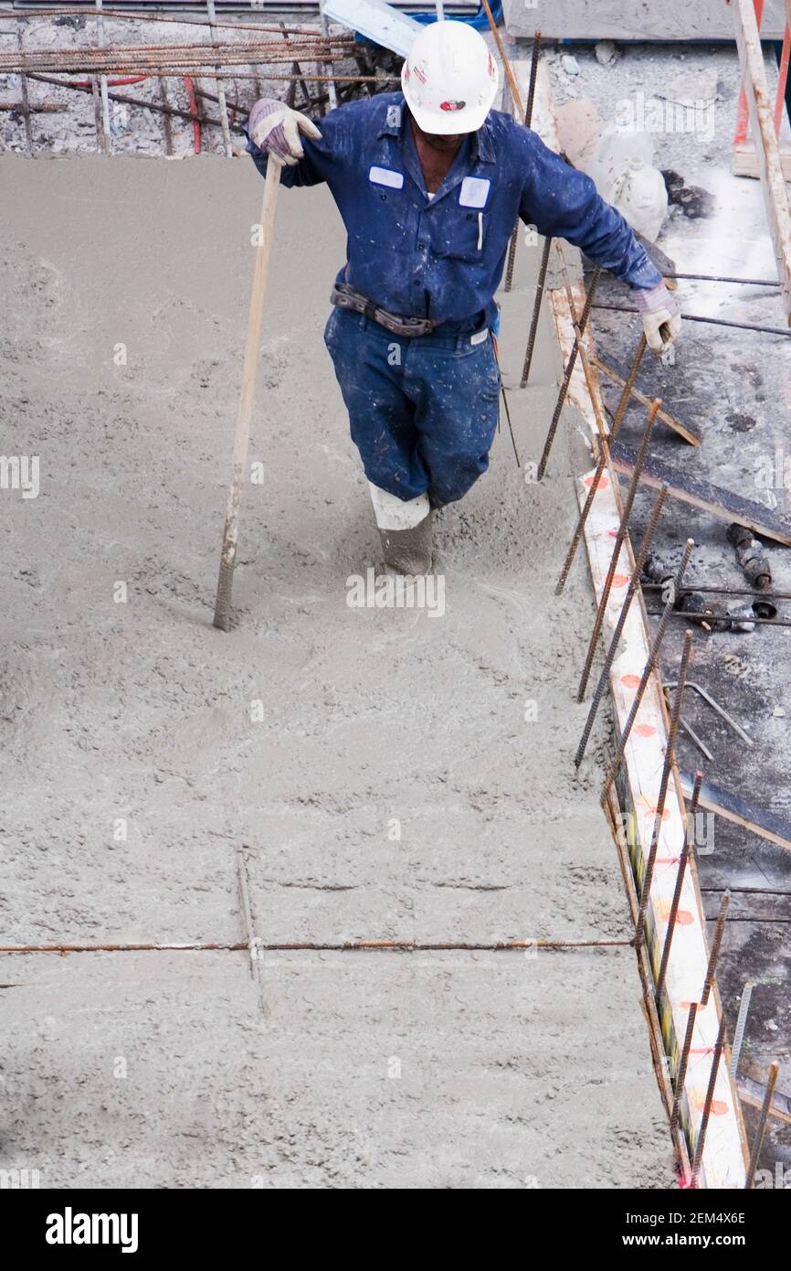 High angle view of a construction worker working at a construction site ...