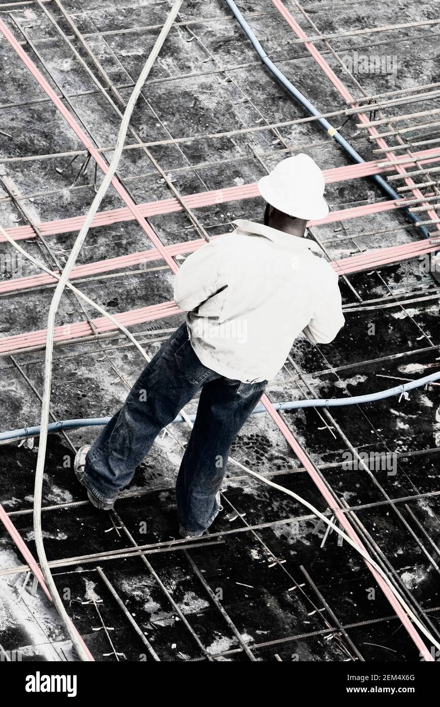 High angle view of a construction worker standing at a construction ...