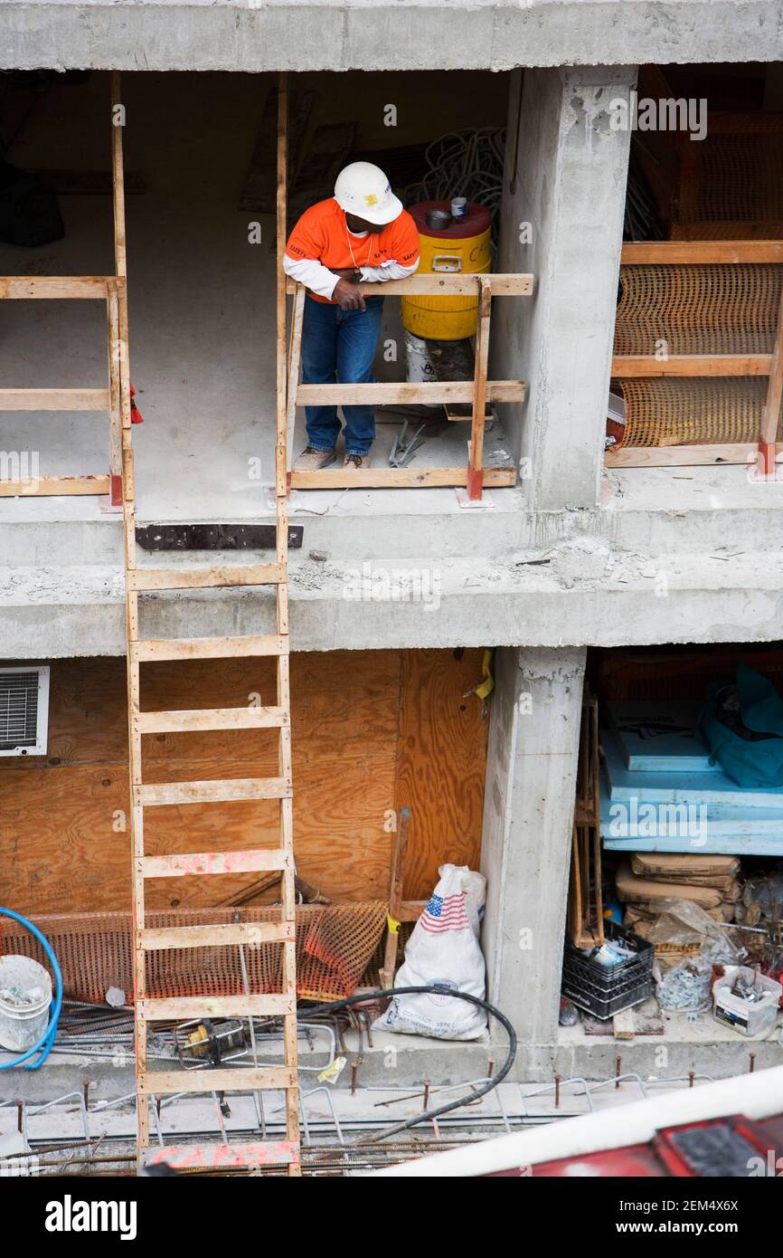 High angle view of a construction worker standing at a construction ...