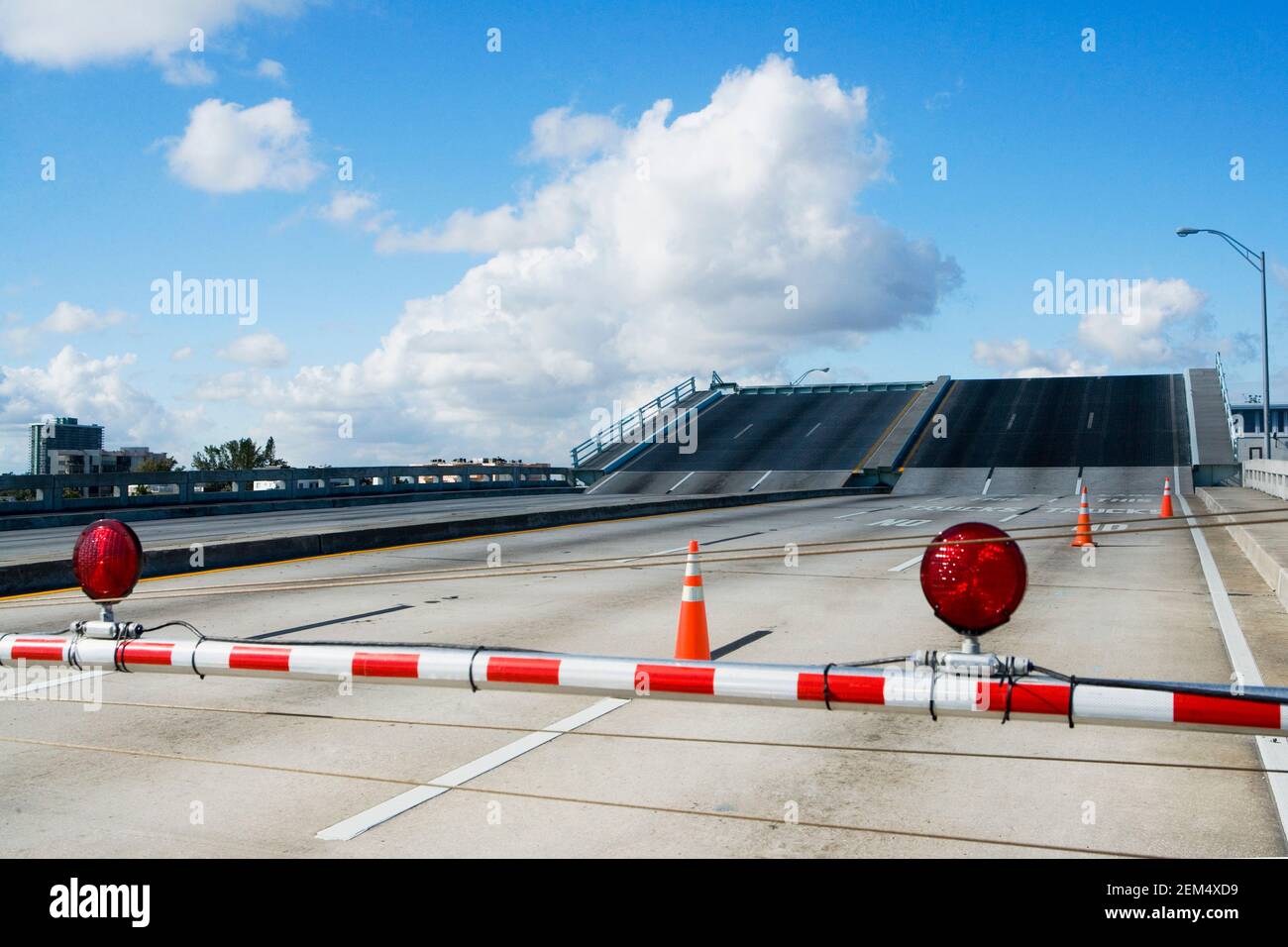 Pole barricade in front of a raising drawbridge Stock Photo - Alamy