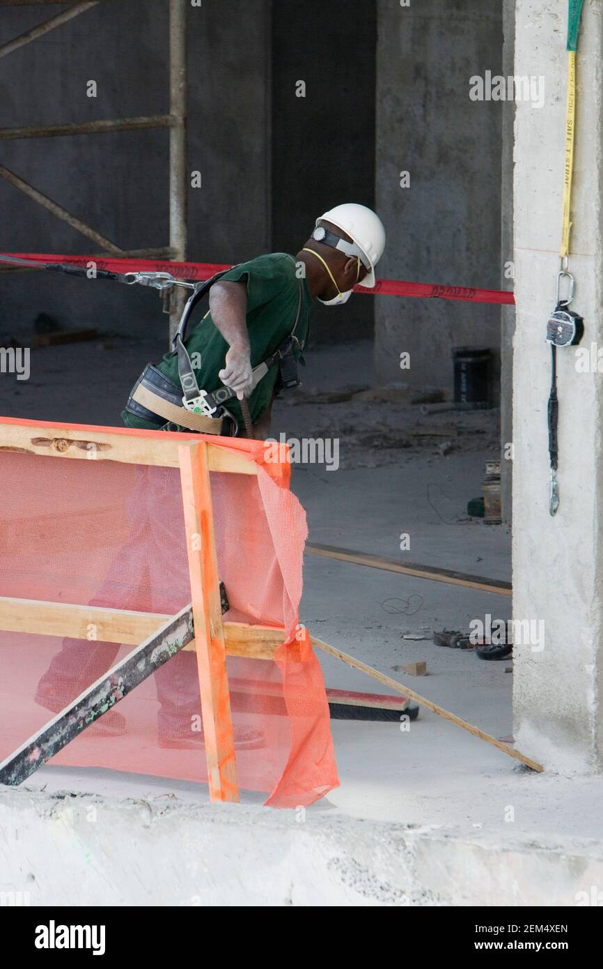 Side profile of a construction worker at a construction site Stock ...