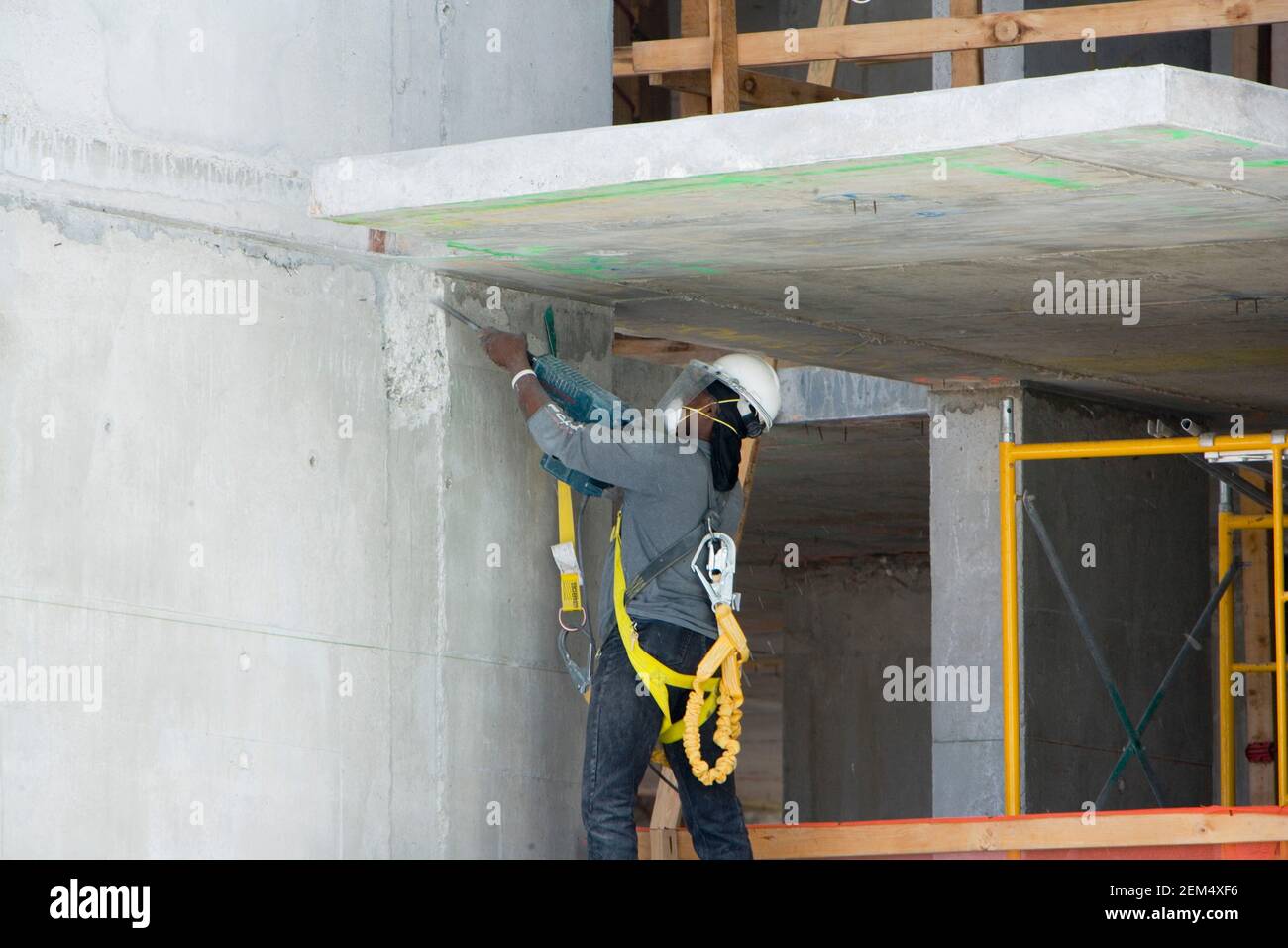 Side view of a construction worker working inside a building Stock ...