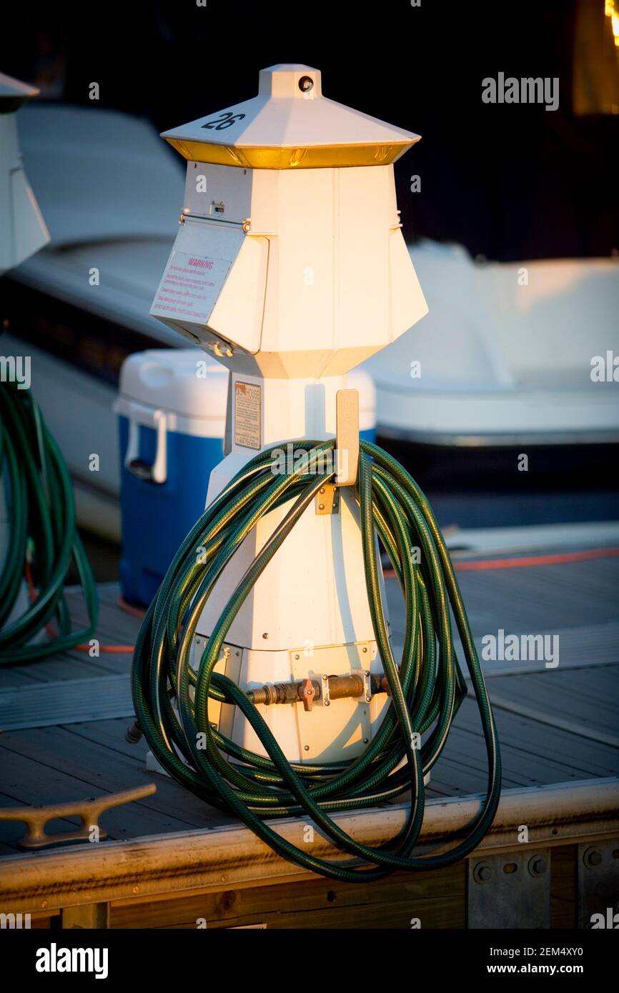 Gas pipe hanging on a gas pump Stock Photo - Alamy
