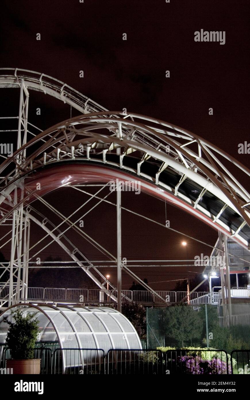 Amusement park ride at an amusement park at night Stock Photo - Alamy