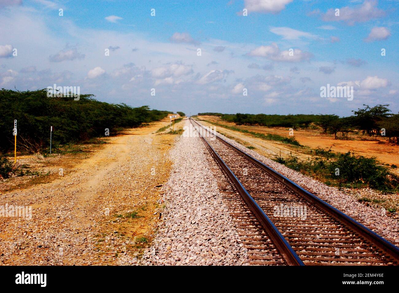 Railroad track passing through a landscape Stock Photo - Alamy