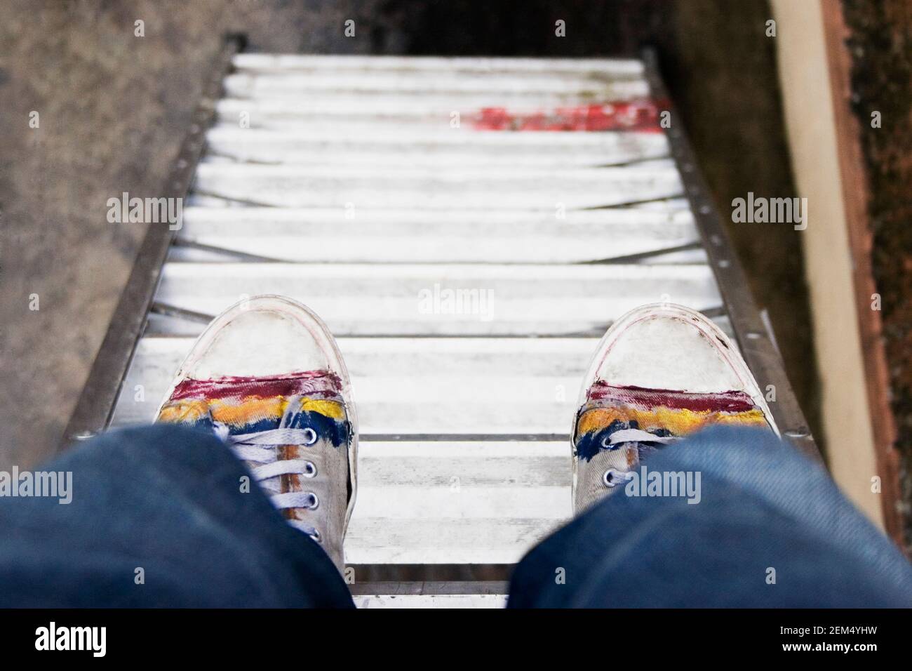 Close-up of a person's legs on a ladder Stock Photo - Alamy