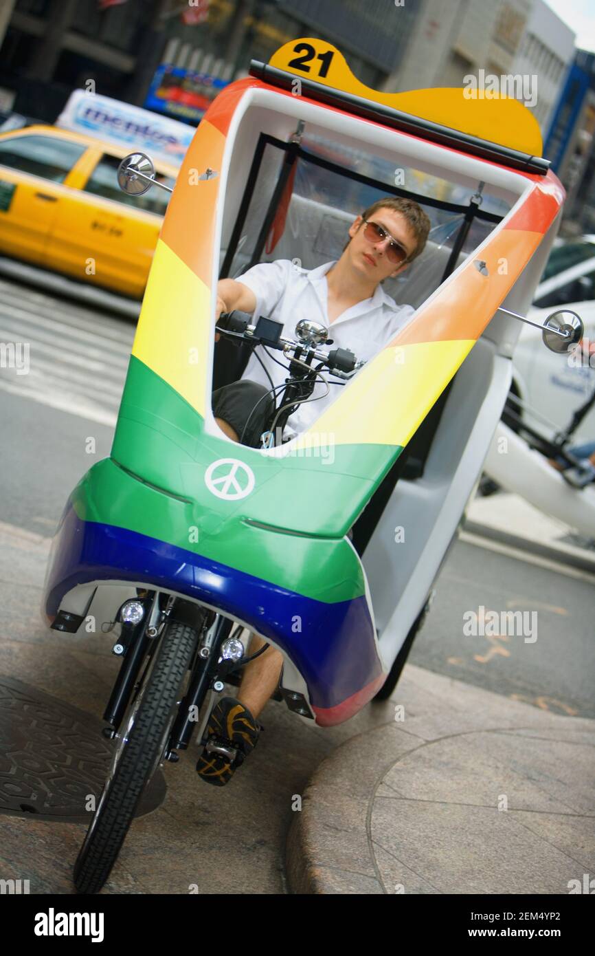 Young man driving a rickshaw, New York City, New York State, USA Stock ...
