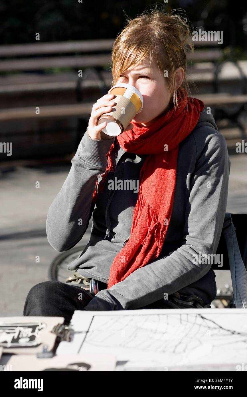 Young woman drinking coffee Stock Photo - Alamy