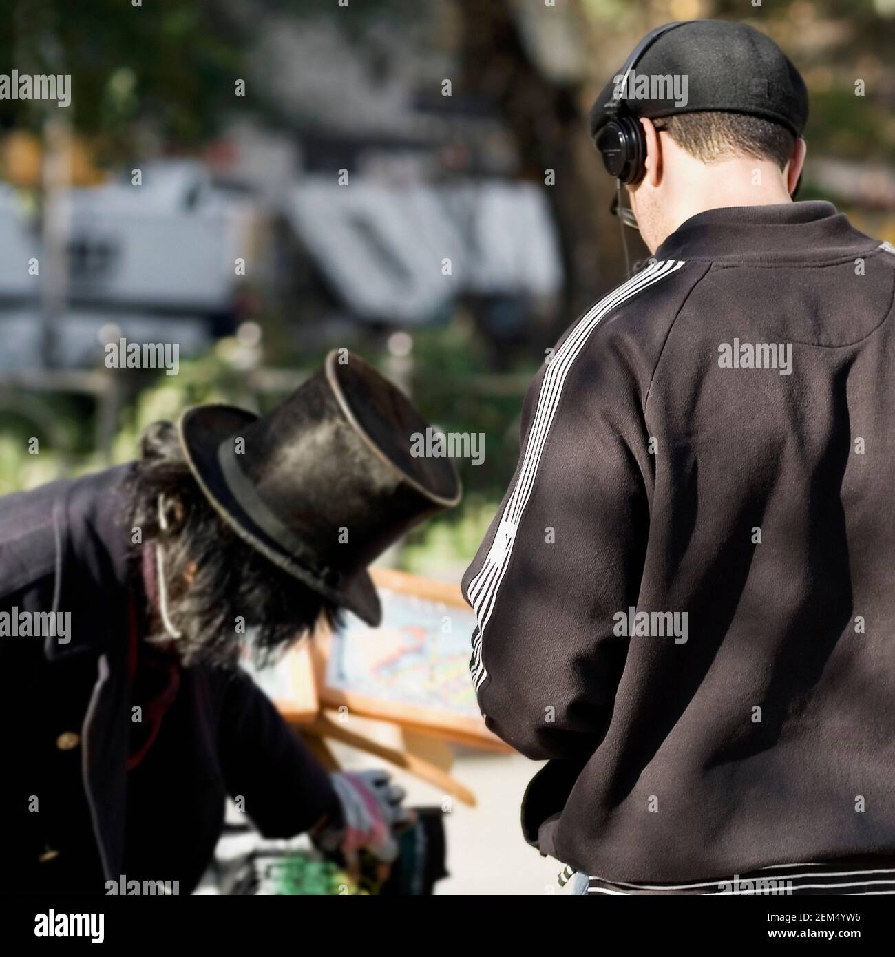 Two men standing at a market stall Stock Photo - Alamy