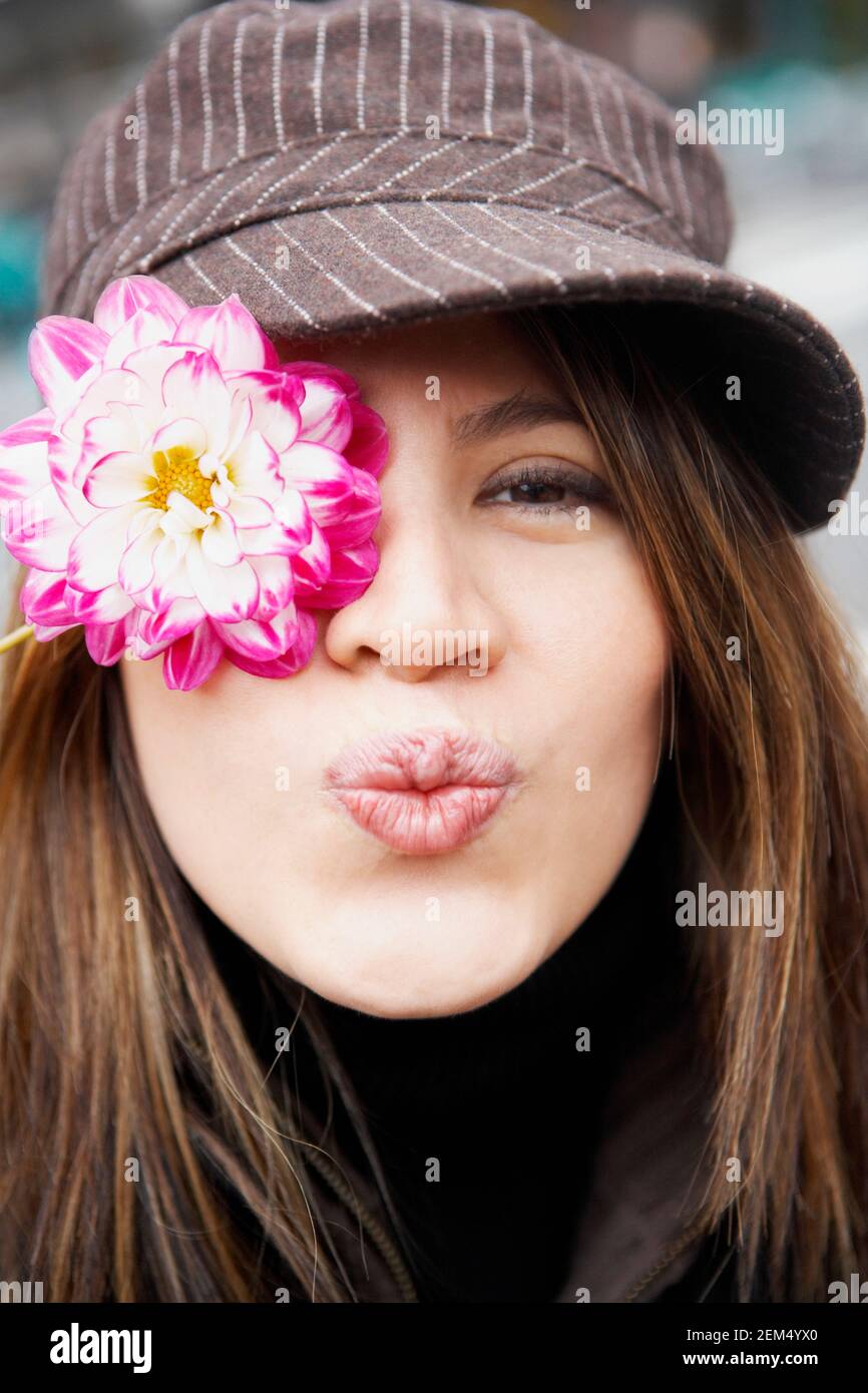 Woman flower covering eye hi-res stock photography and images - Alamy