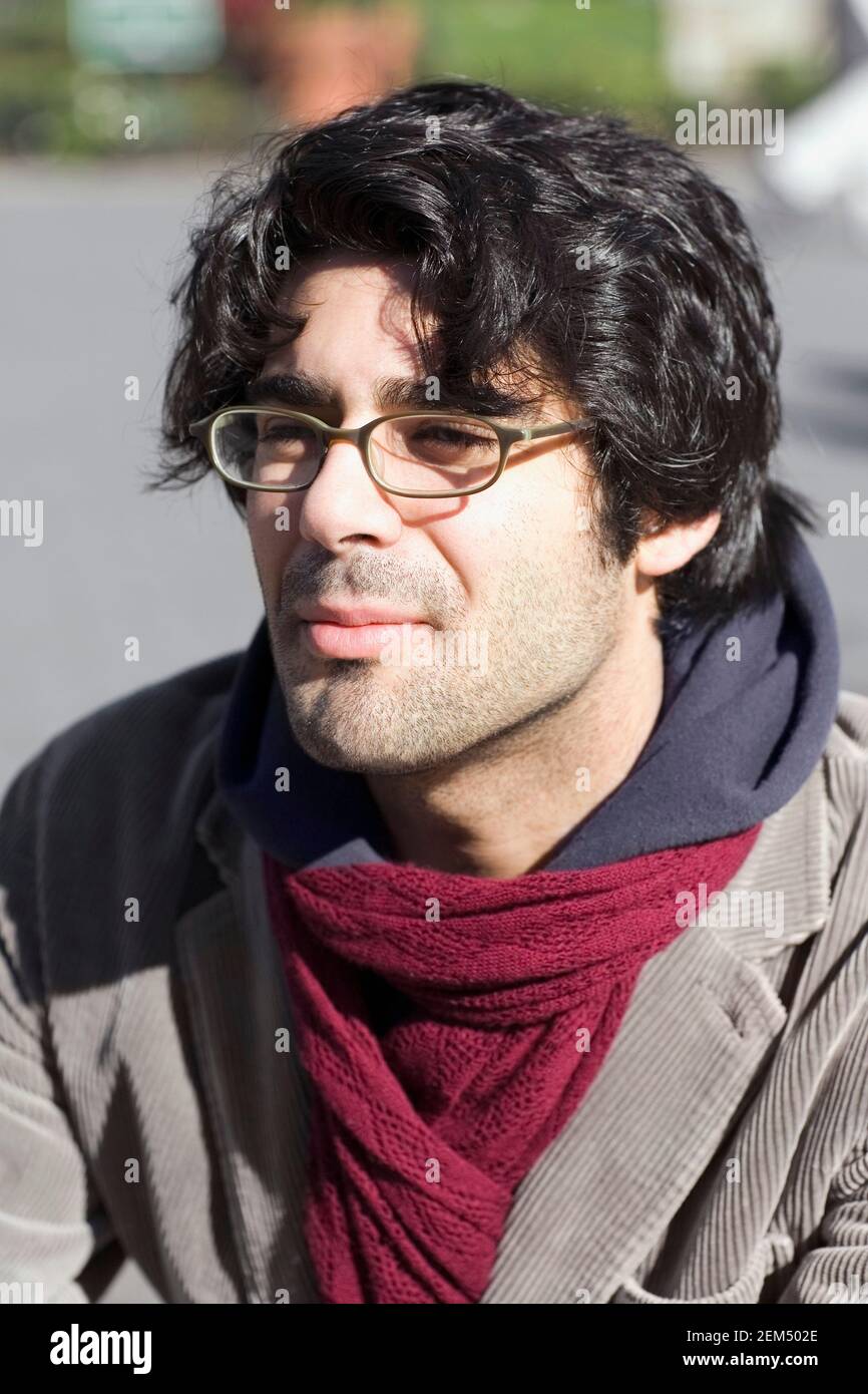Close-up of a young man looking serious Stock Photo - Alamy