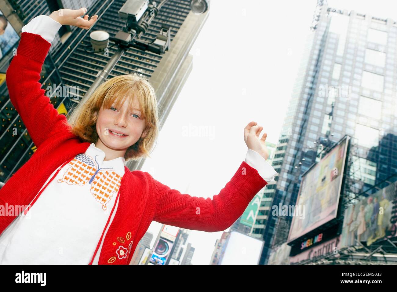 Portrait of a girl with her arms raised Stock Photo - Alamy