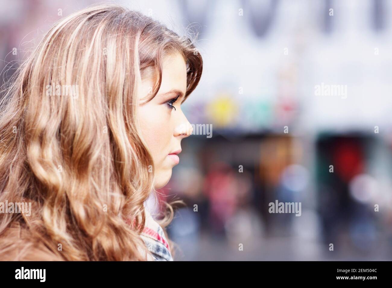 Side profile of a teenage girl looking serious Stock Photo - Alamy