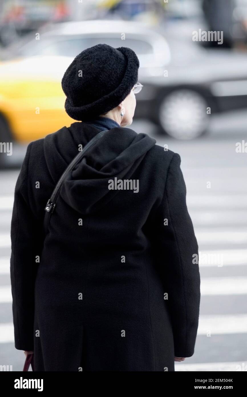 Rear view of a woman standing Stock Photo - Alamy