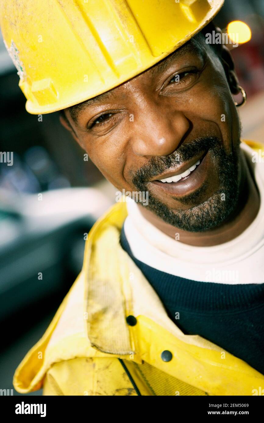 Portrait of a construction worker smiling Stock Photo - Alamy
