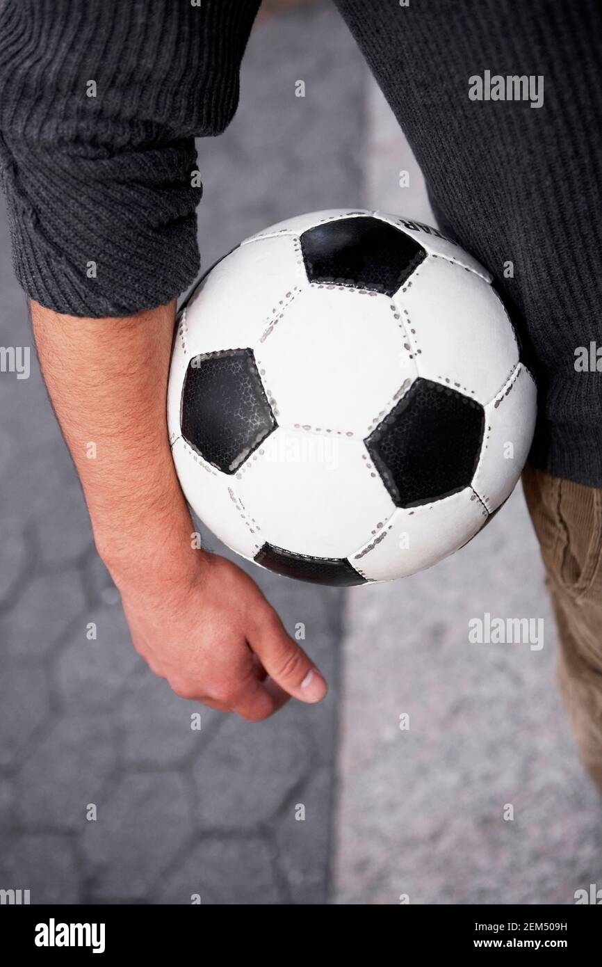 Mid section view of a man with a soccer ball Stock Photo - Alamy