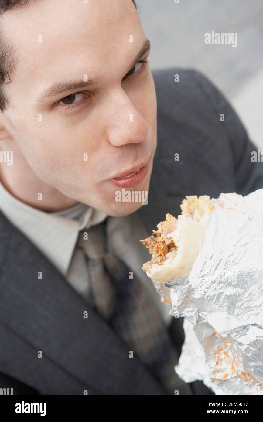 Hispanic man eating hi-res stock photography and images - Alamy