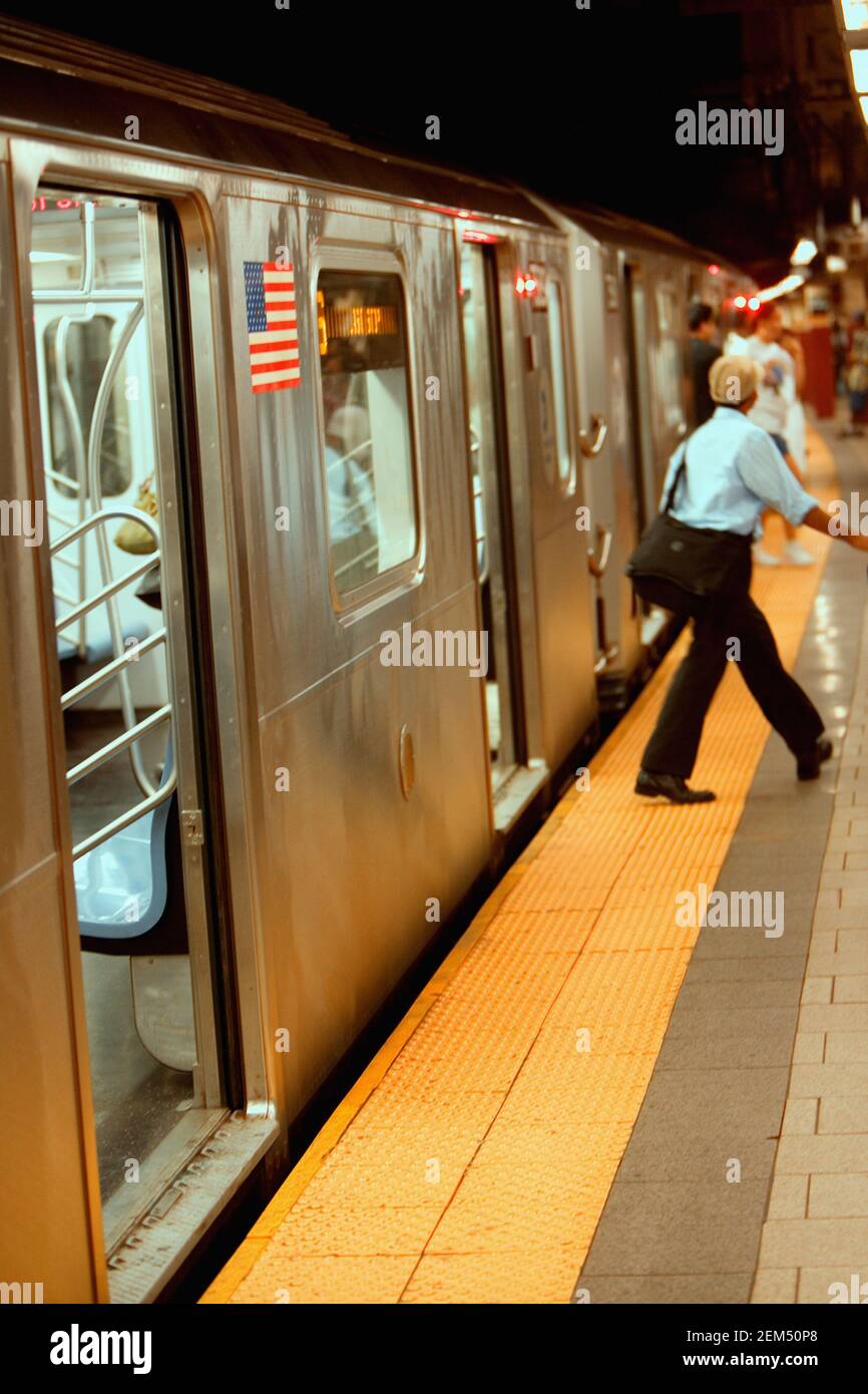 Passengers exiting from a subway train Stock Photo - Alamy