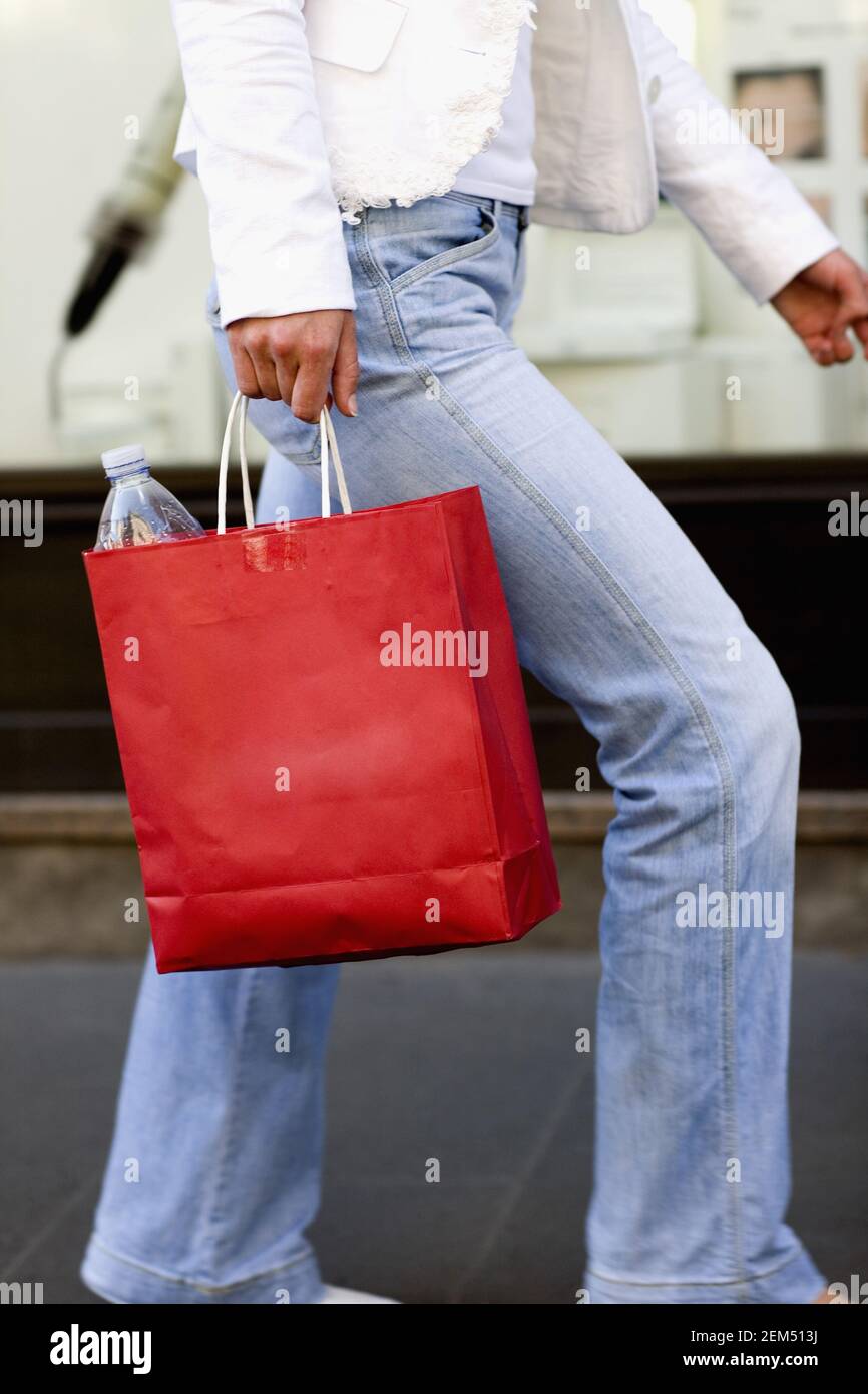 Walking carrying profile hi-res stock photography and images - Alamy